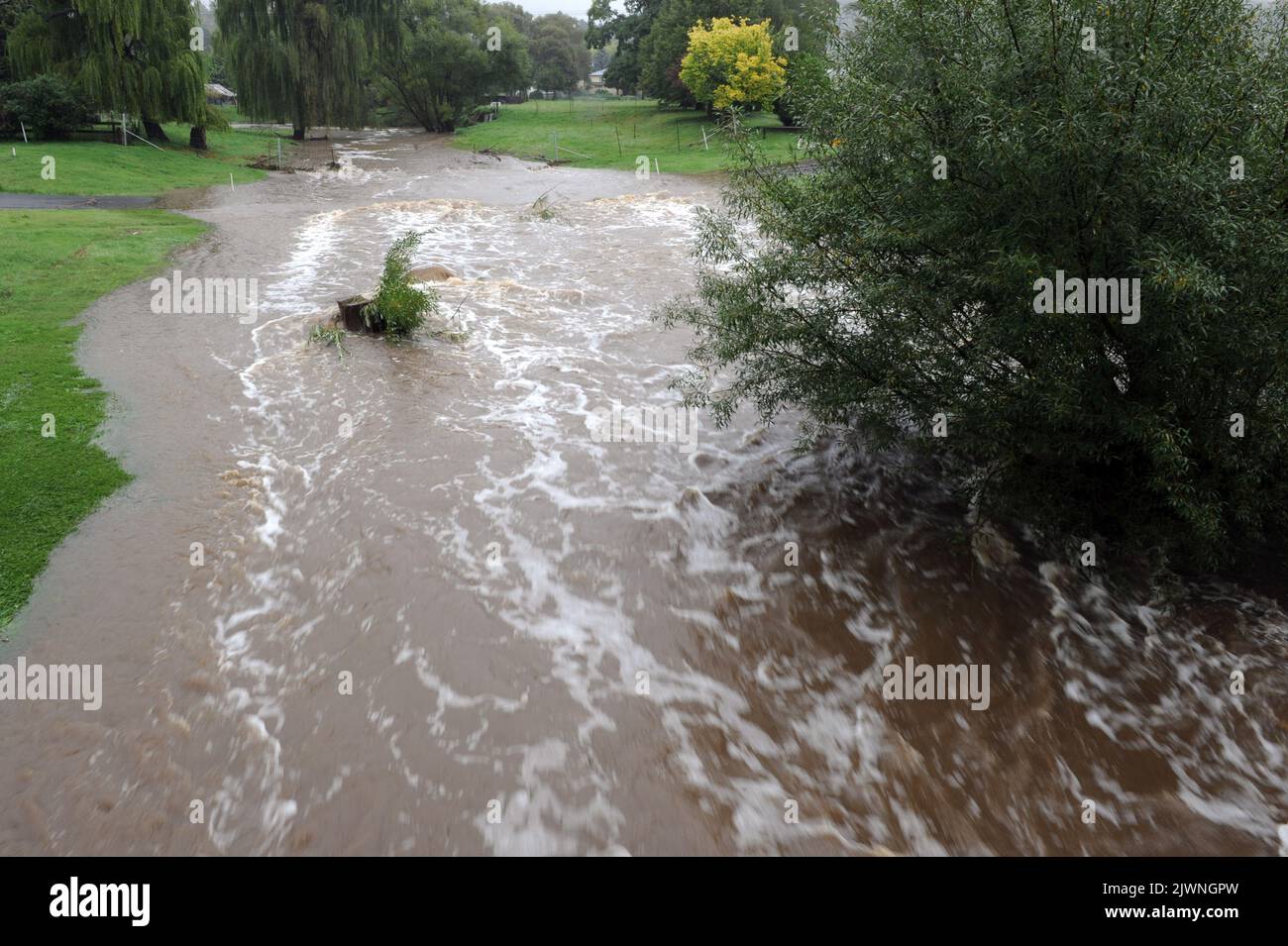 Water rushes down Cooma Back Creek in Cooma, Thursday, March. 1, 2012 ...