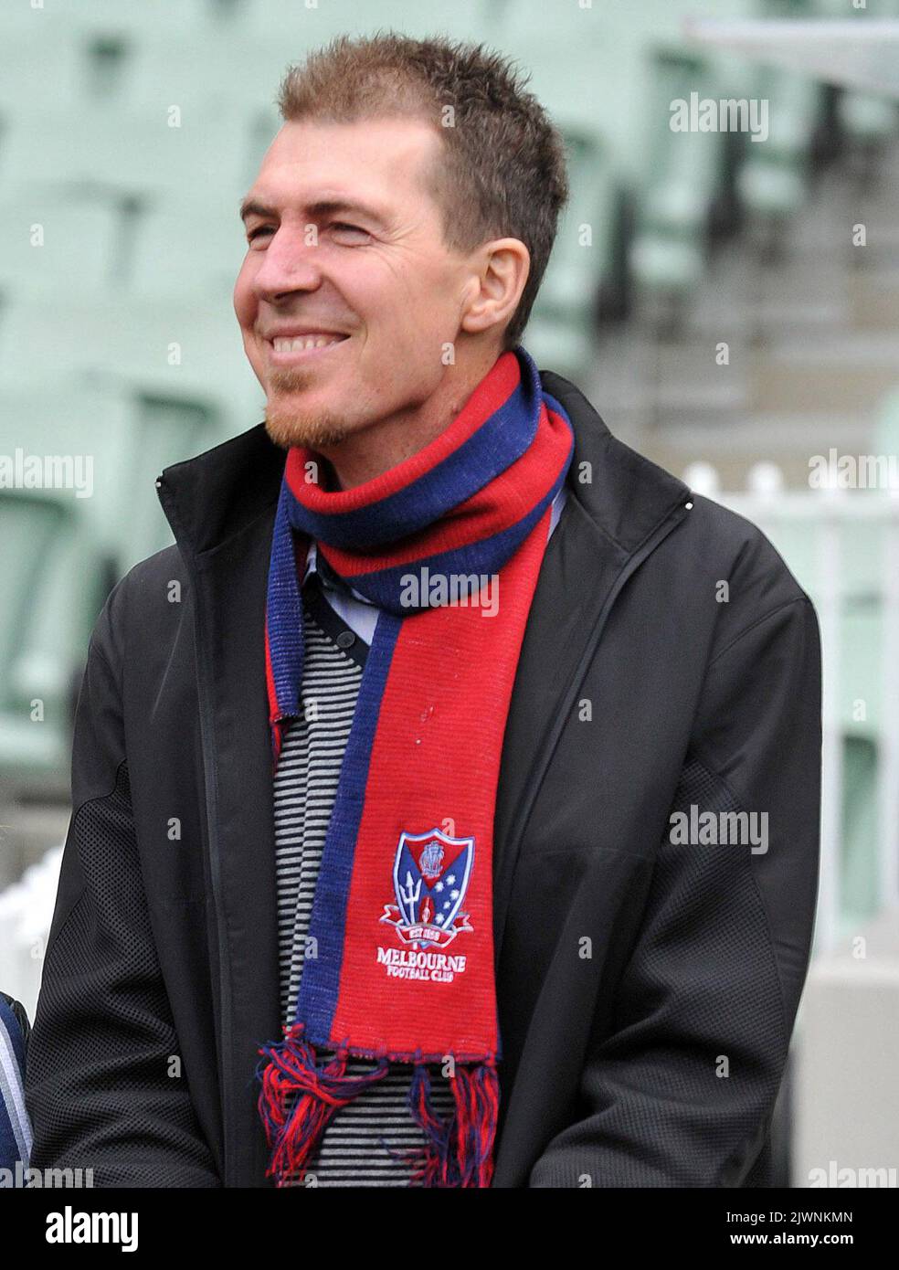 File Photo. Olivia Newton-John (left) and Jim Stynes share a joke at ...