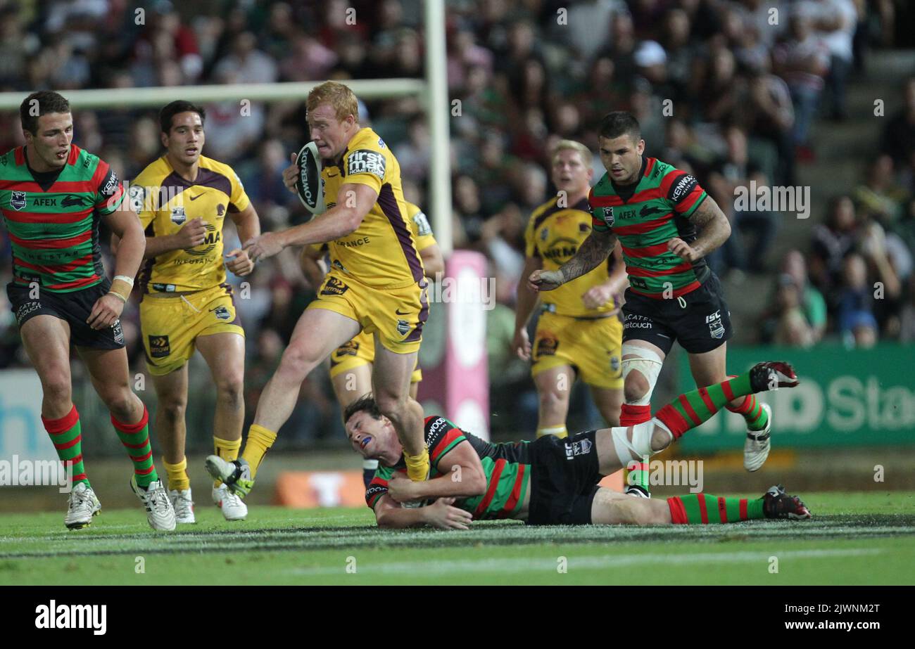 Jack Reed tries to escape Chris McQueen during NRL Rugby League match ...