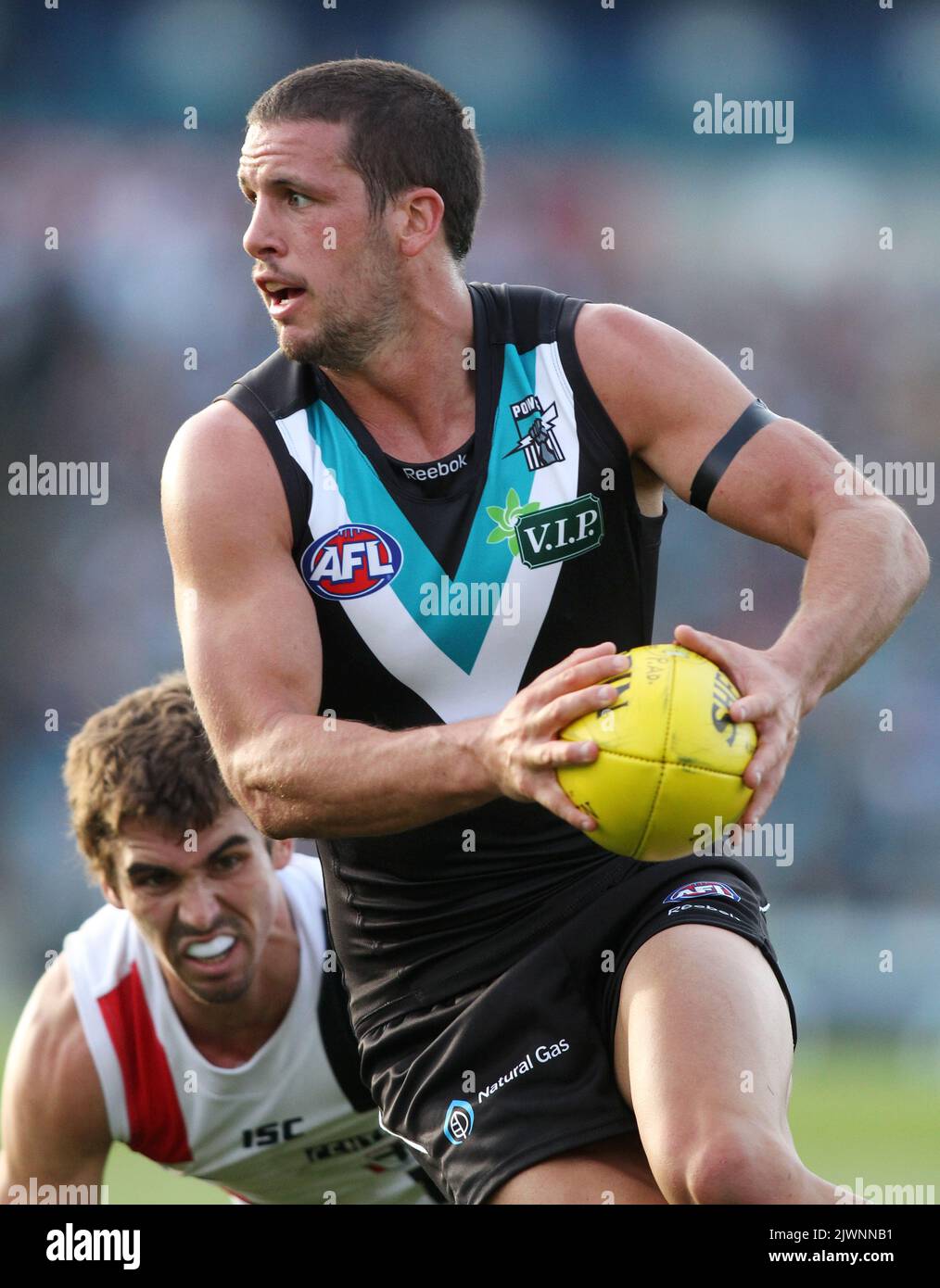Travis Boak of Port Adelaide out runs Jamie Cripps of St Kilda during ...