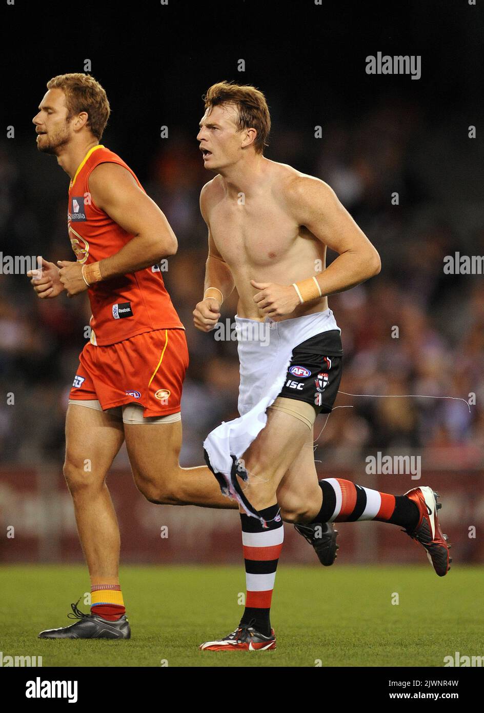 Brendon Goddard of St Kilda runs back to the bench after having his top ...