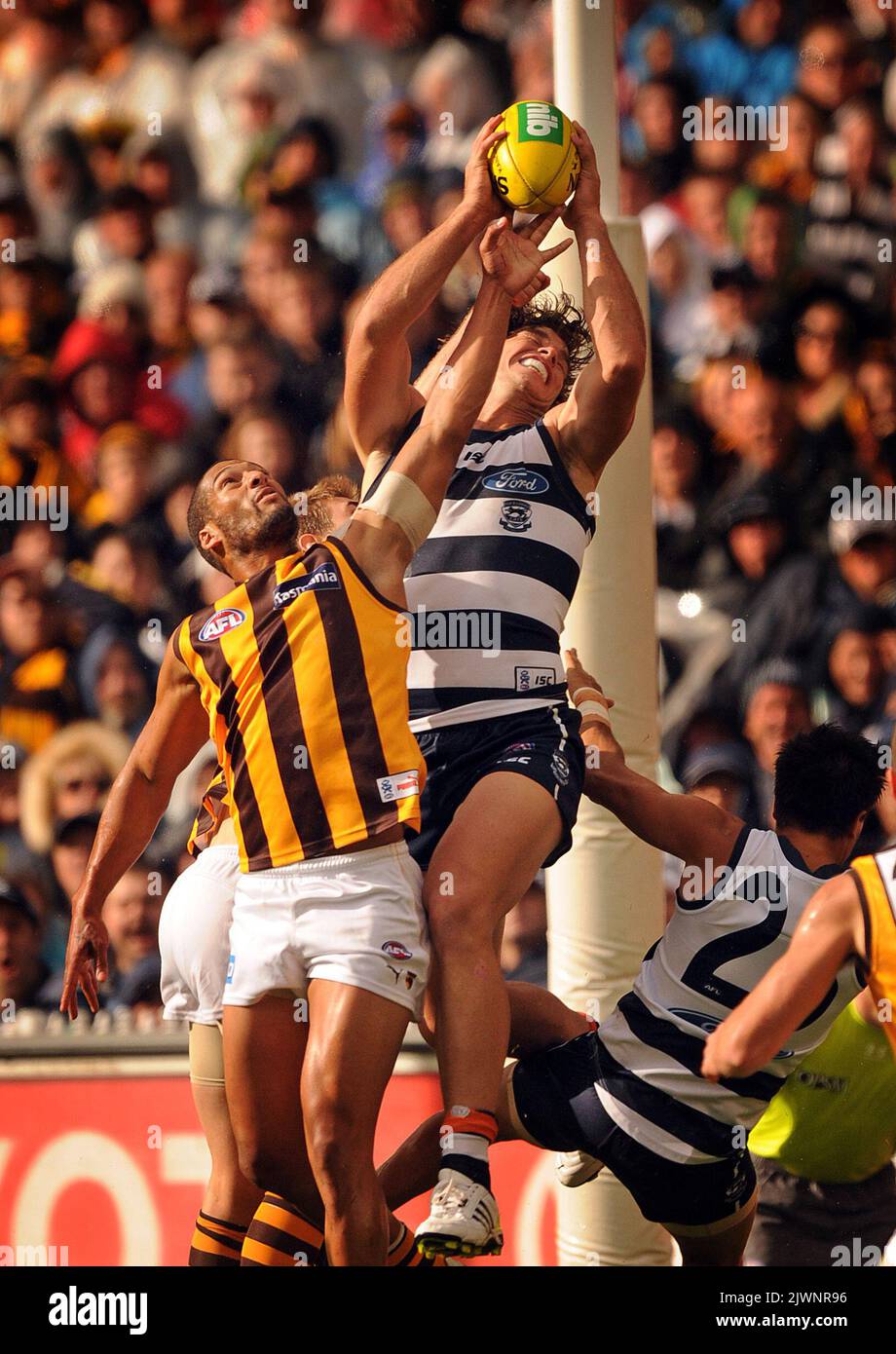 Tom Hawkins of Geelong marks the ball over Josh Gibson of Hawthorn ...