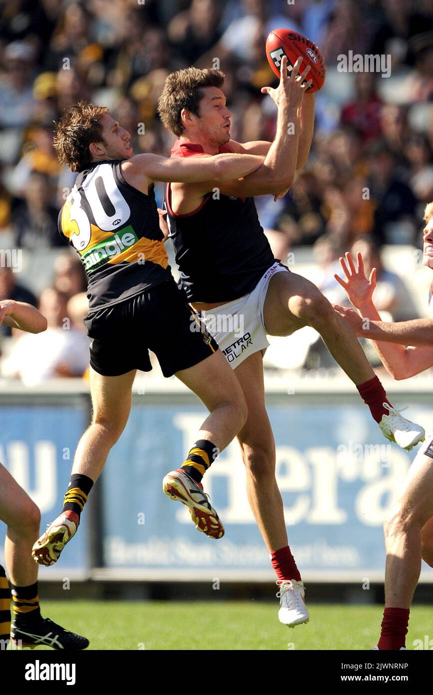 Stefan Martin of Melbourne marks the ball against Reece Conca of ...
