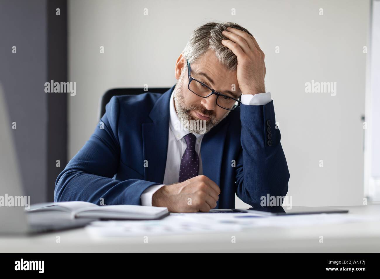 Work Burnout. Portrait Of Upset Mature Businessman Sitting At Desk In ...