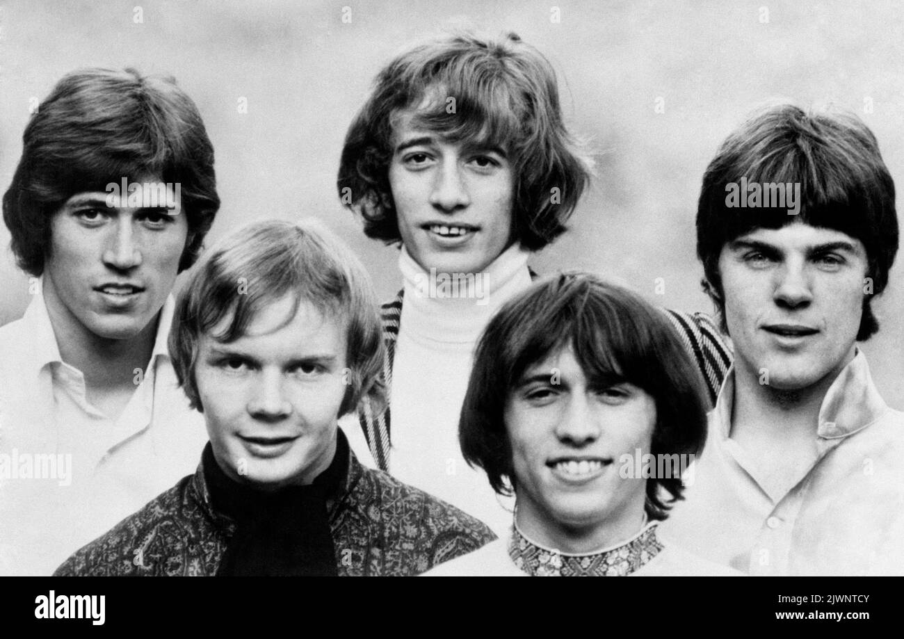 The Bee Gees, back row, left to right: Barry Gibb, Robin Gibb, and ...