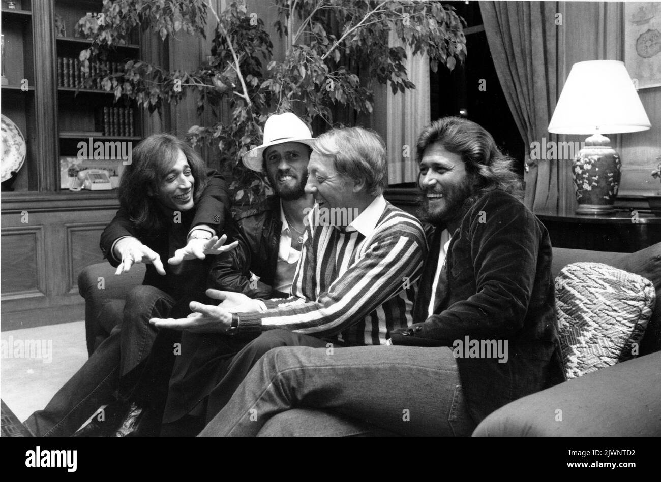 The Bee Gees sit with Robert Stigwood, center, in New York City on May ...
