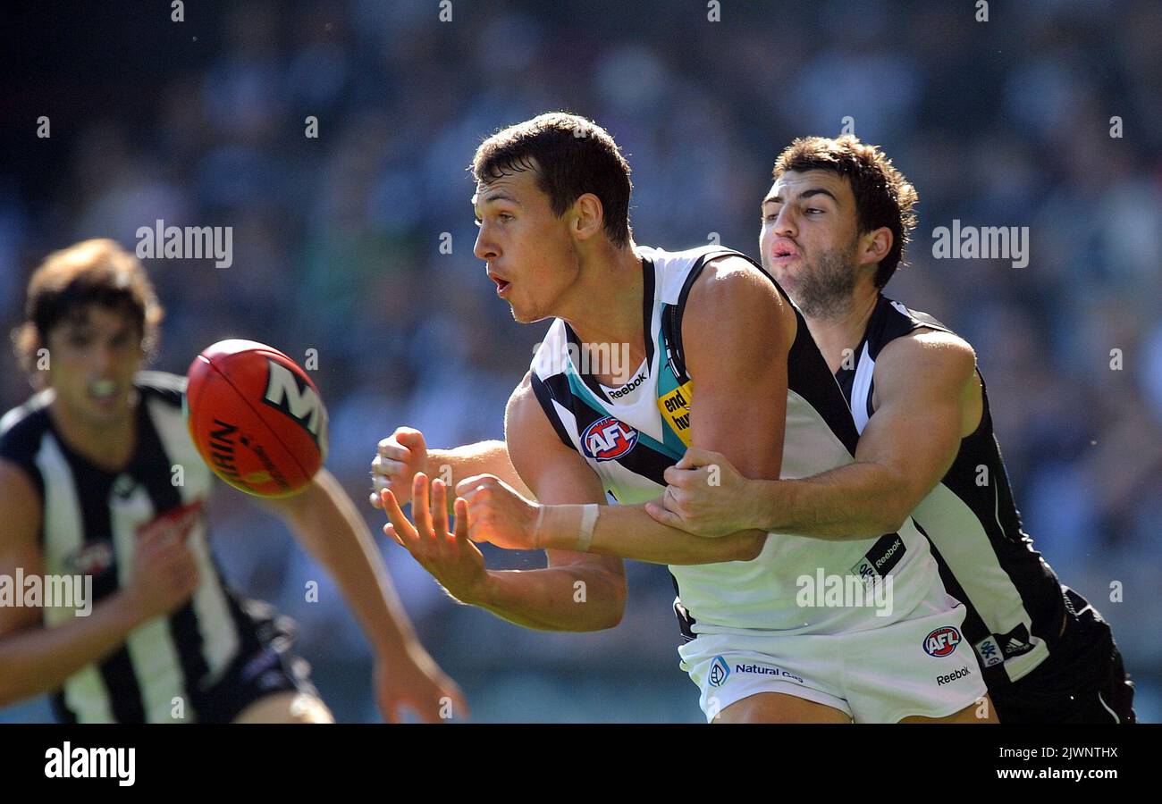 Alex Fasolo of Collingwood tackles Ben Jacobs of Port Adelaide, during ...