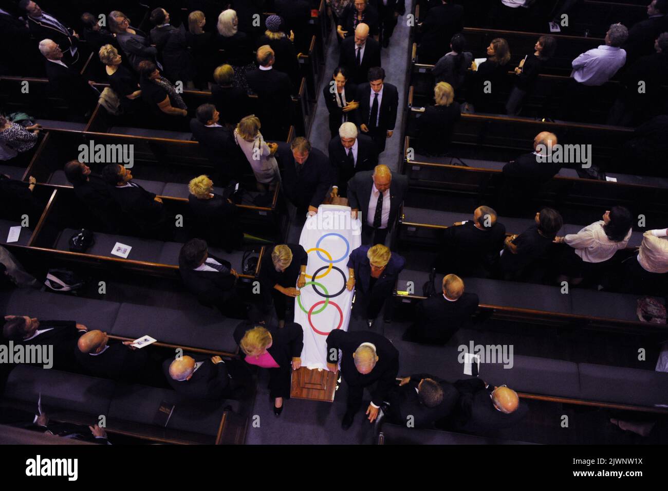 The casket of Olympic swimmer Murray Rose, draped in a flag bearing the ...