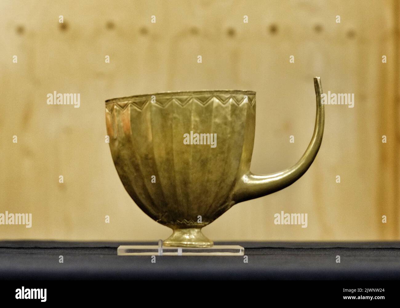 British Museum curator Sarah Collins unveils an ancient gold drinking ...