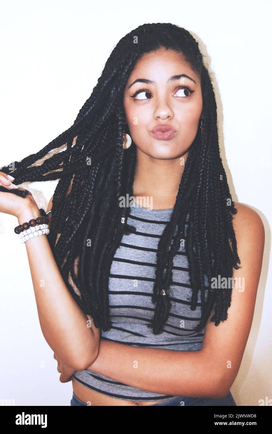 Throwing around a little attitude. Studio shot of an attractive young ...