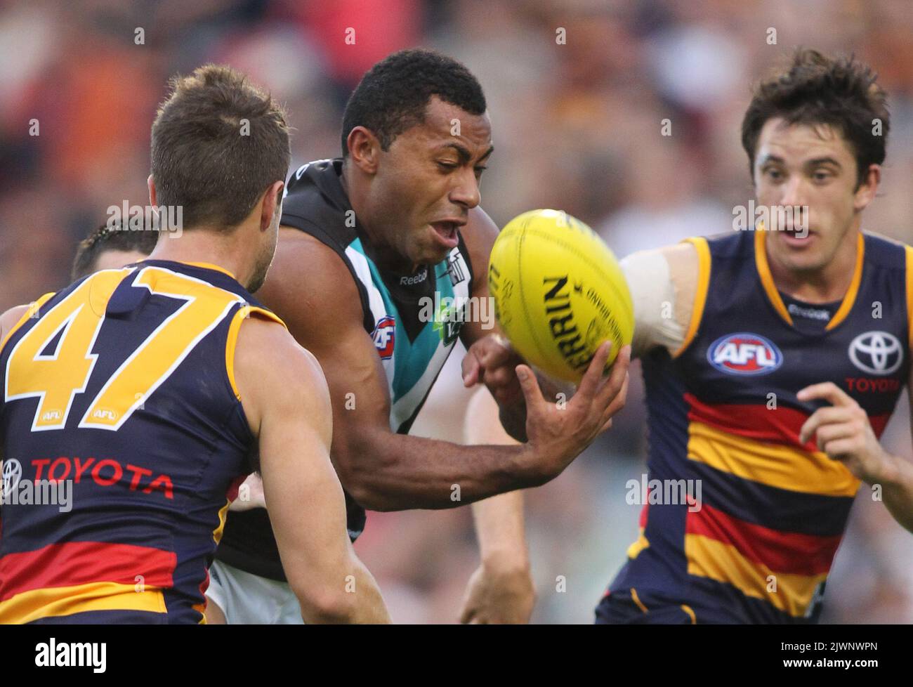 David Rodan of Port Adelaide breaks away from Adelaide Crows defence ...