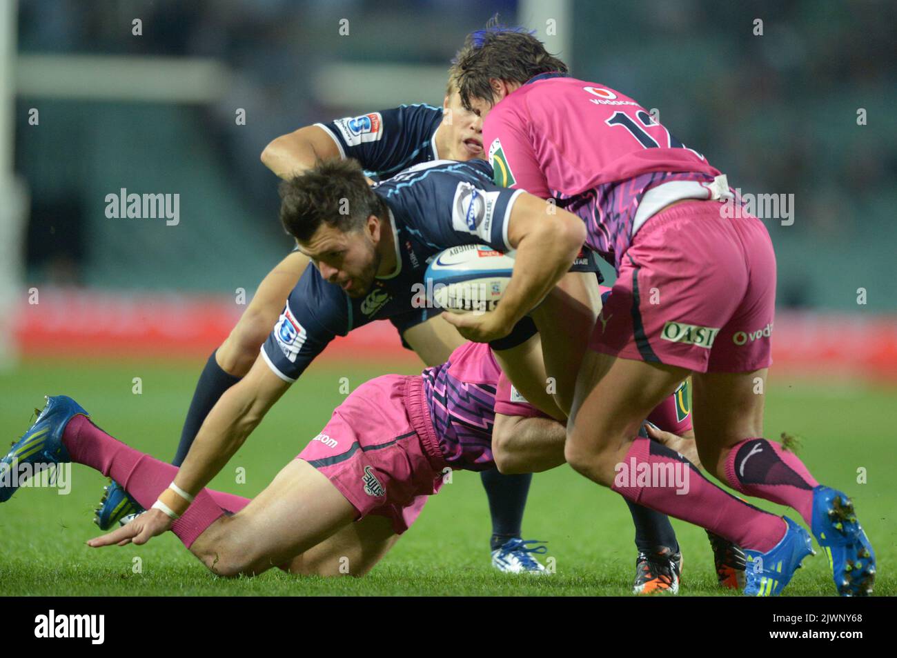 The Waratahs Adam Ashley Cooper is tackled by the Bulls Venter Jacobus ...