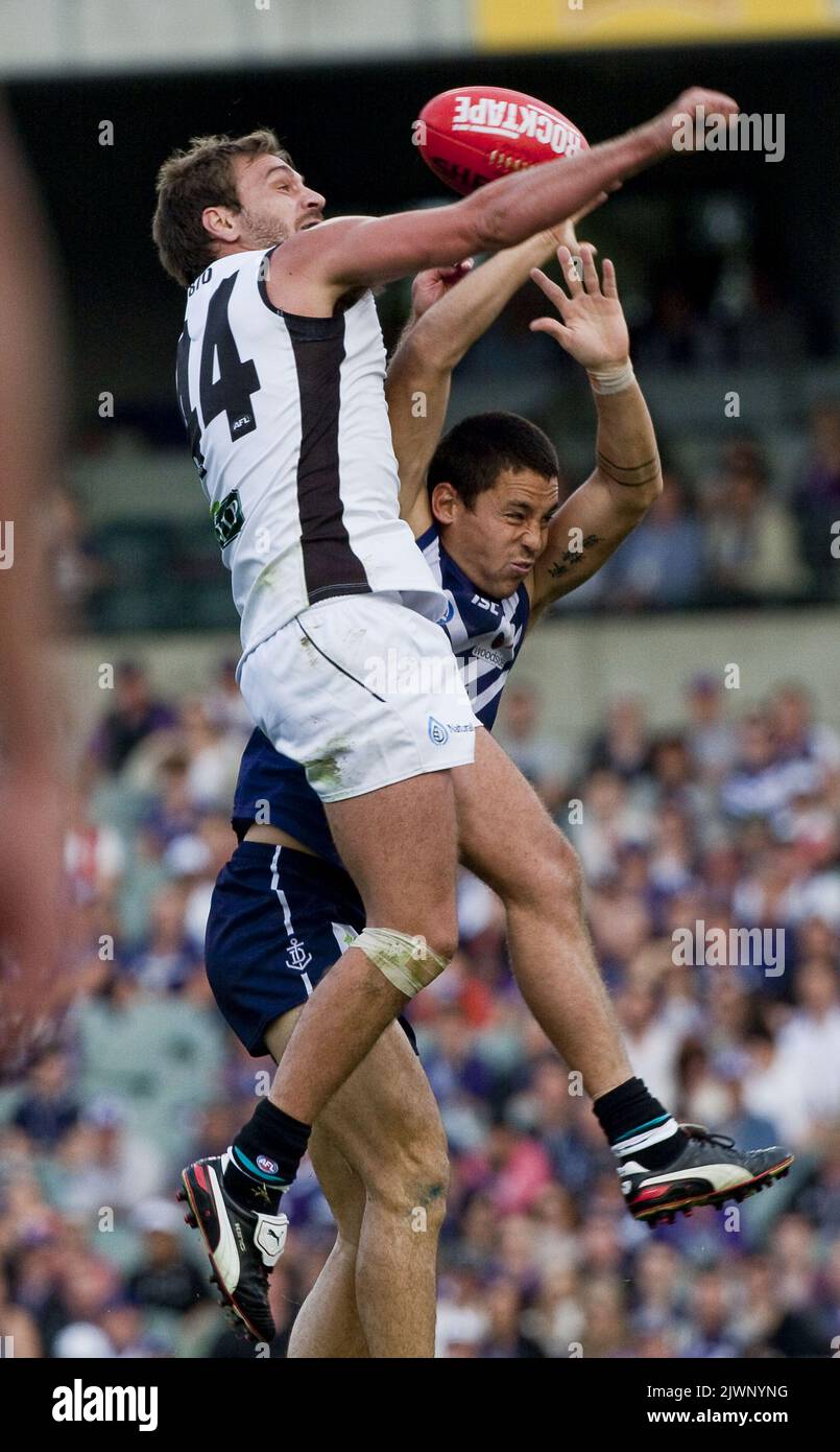 Tom Logan for Port Adelaide and Greg Broughton for Fremantle during the ...