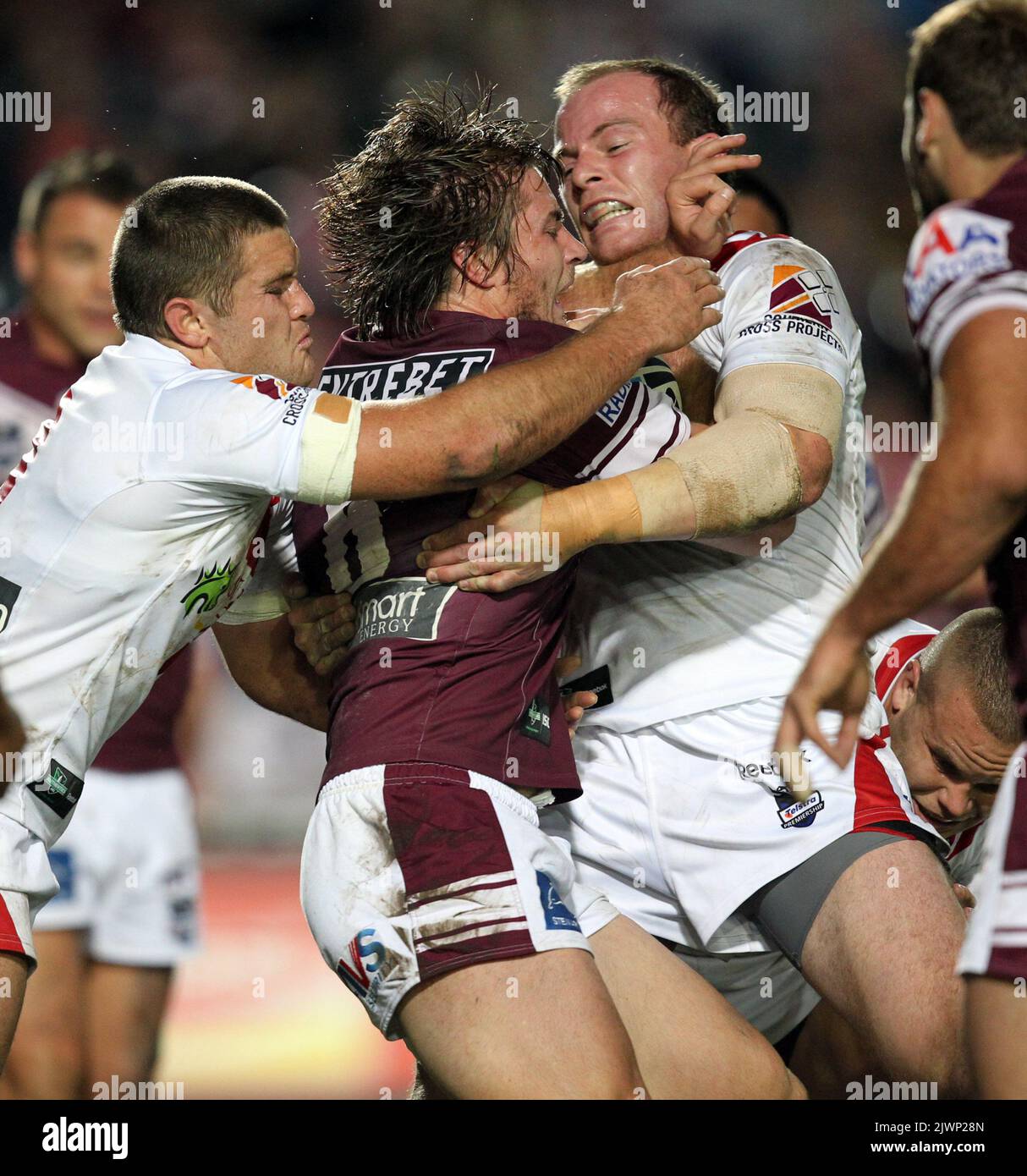 Keiran Foran wrapped up by Beau Scott during the NRL Round 13, match ...
