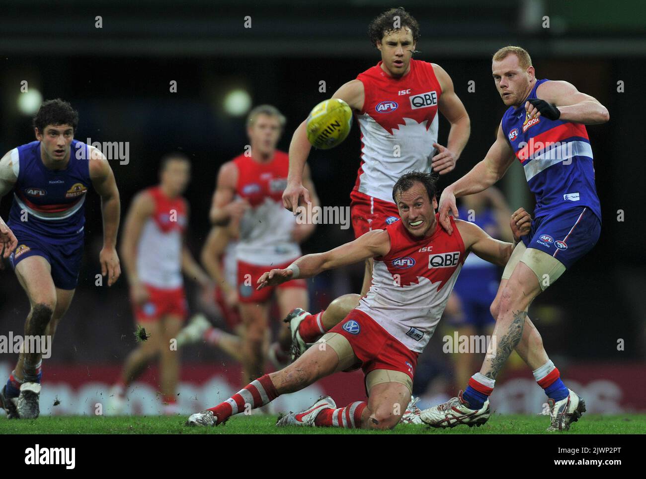 The Sydney Swans' Jude Bolton (centre) competes for the ball with Adam ...