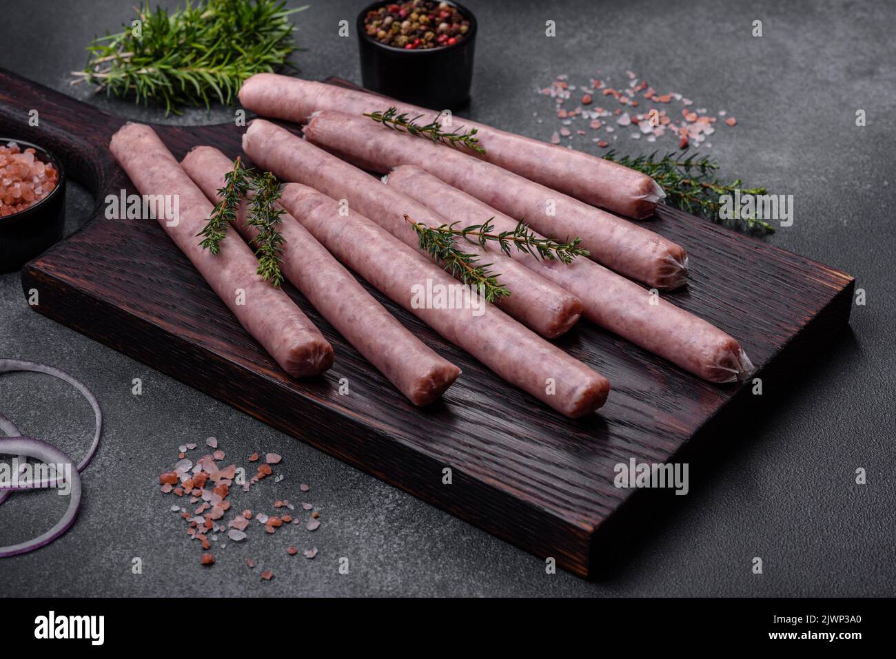 Raw sausages and ingredients for cooking. Top view with copy space on ...