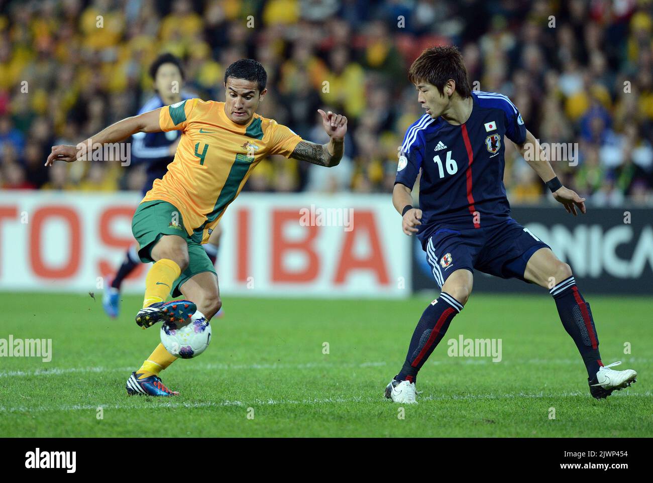 Socceroos player Tim Cahill (L) and Japans Yuzo Kurihara (R) during the ...