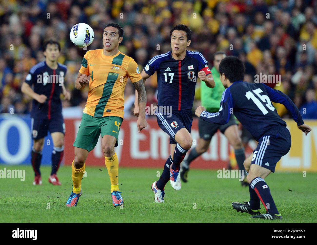 Socceroos player Tim Cahill (L) competes for the ball during the 2014 ...