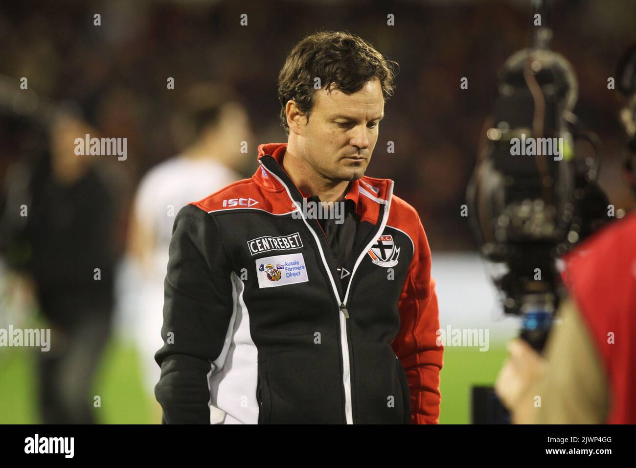 St Kilda coach Scott Watters leaves the huddle at three quarter time ...