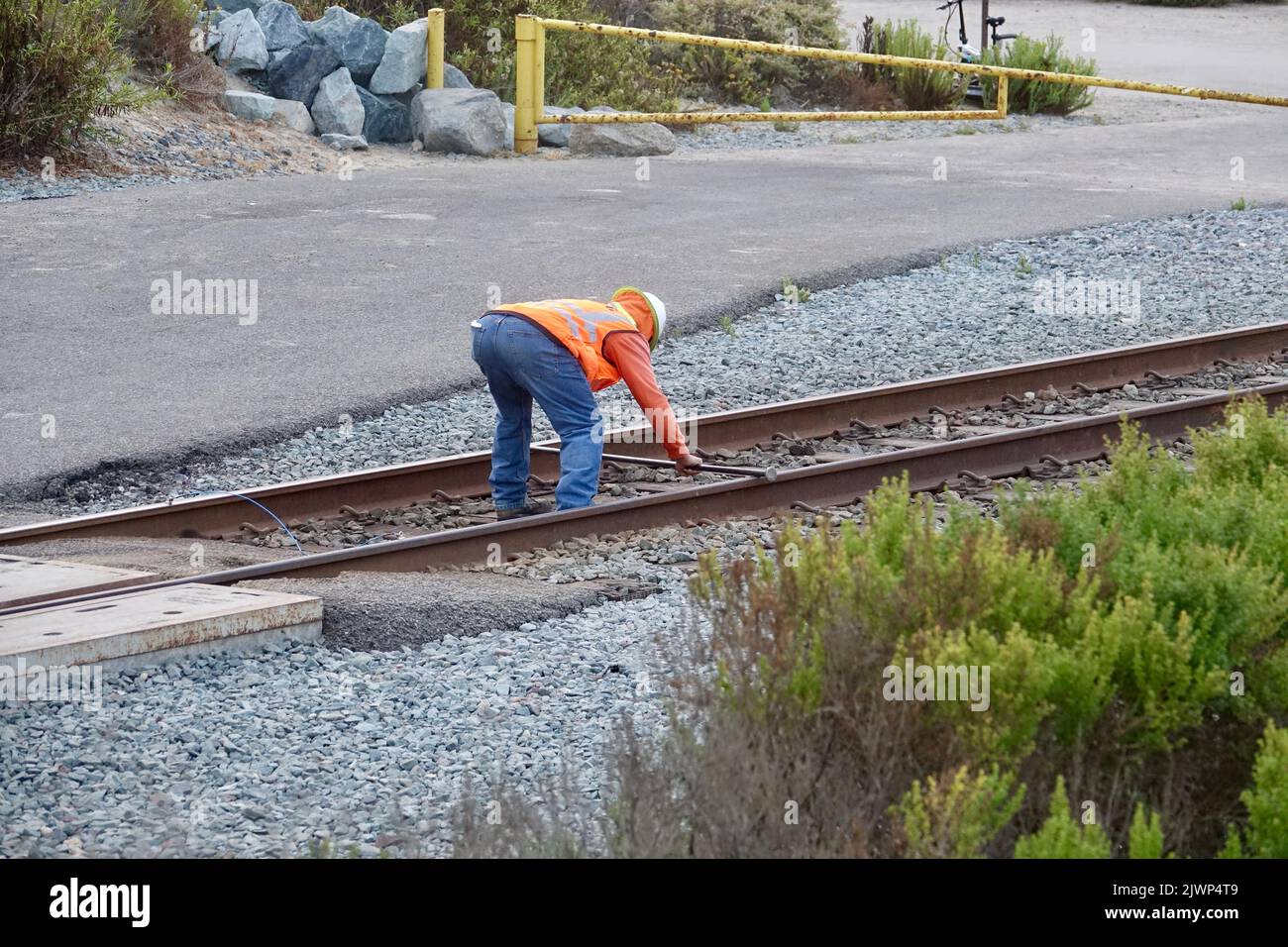 worker inspecting the tracks on the railroad Stock Photo - Alamy
