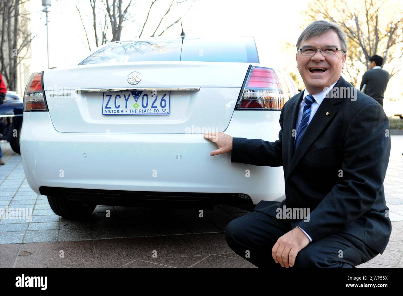 Special minister of state Gary Gray laughs as he shows the exhaust pipe ...