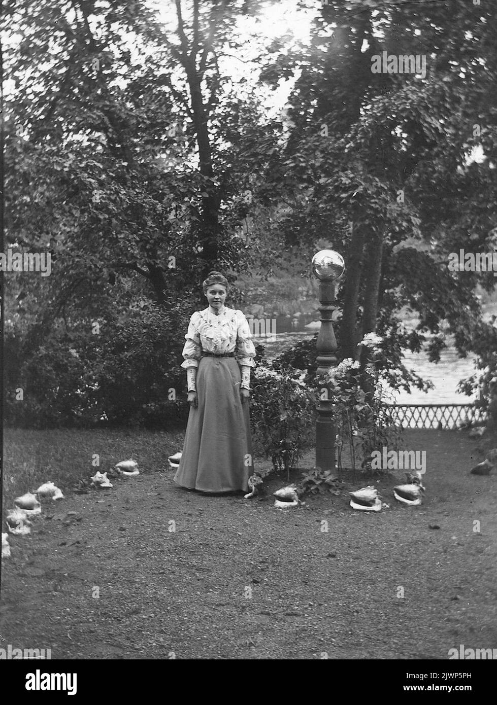 The lottery in the garden by the river. Lotten i trädgården vid ån ...