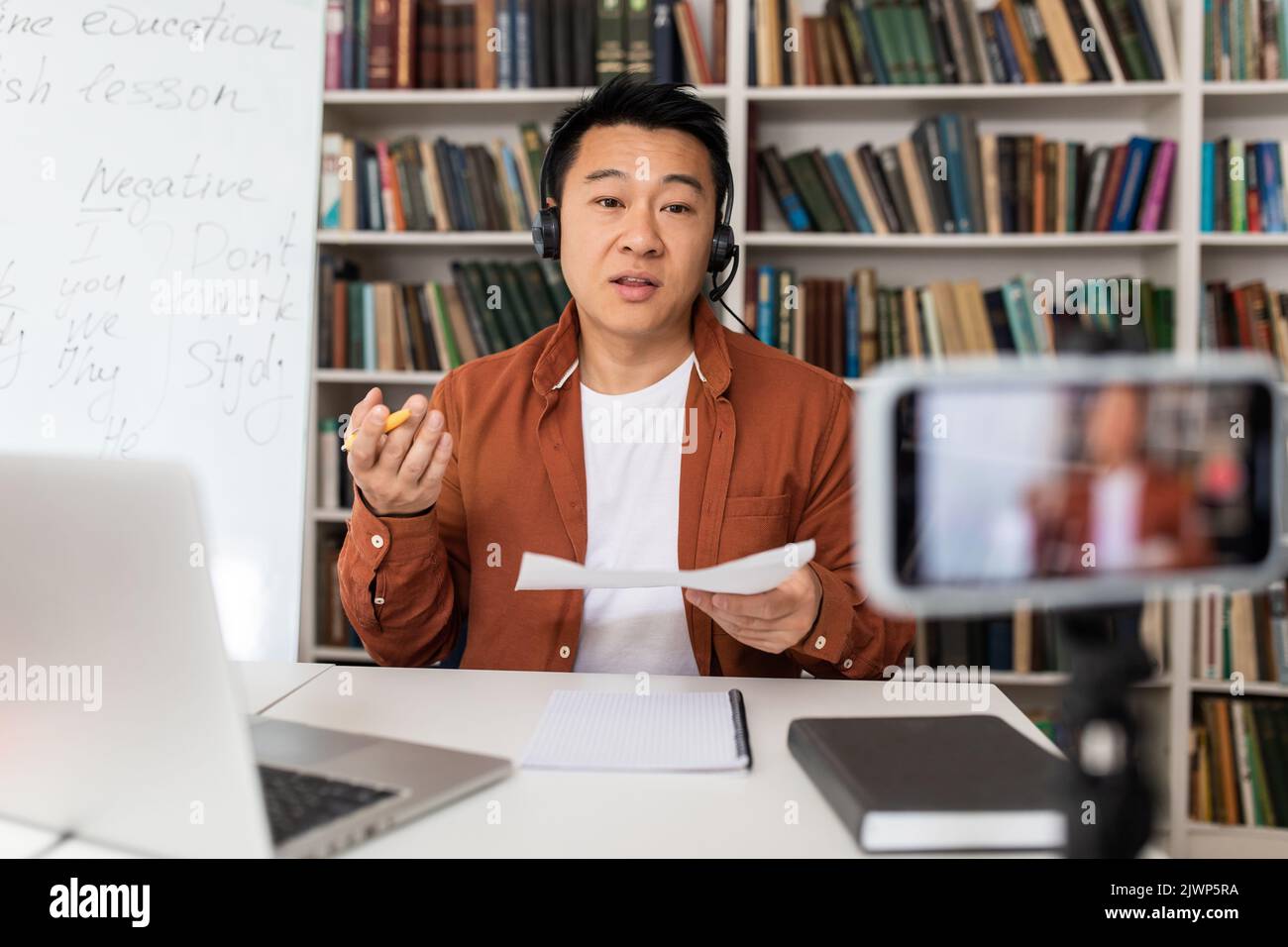 Chinese Teacher Having Online Class Video Calling Via Laptop Indoor ...