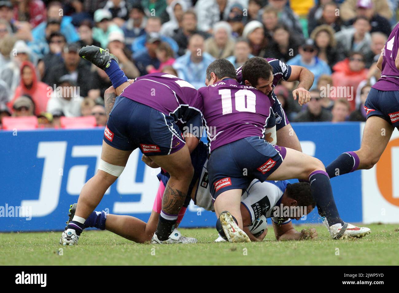 Sam Kasiano downed by Sika Manu, Jason Ryles and Cameron Smith during ...