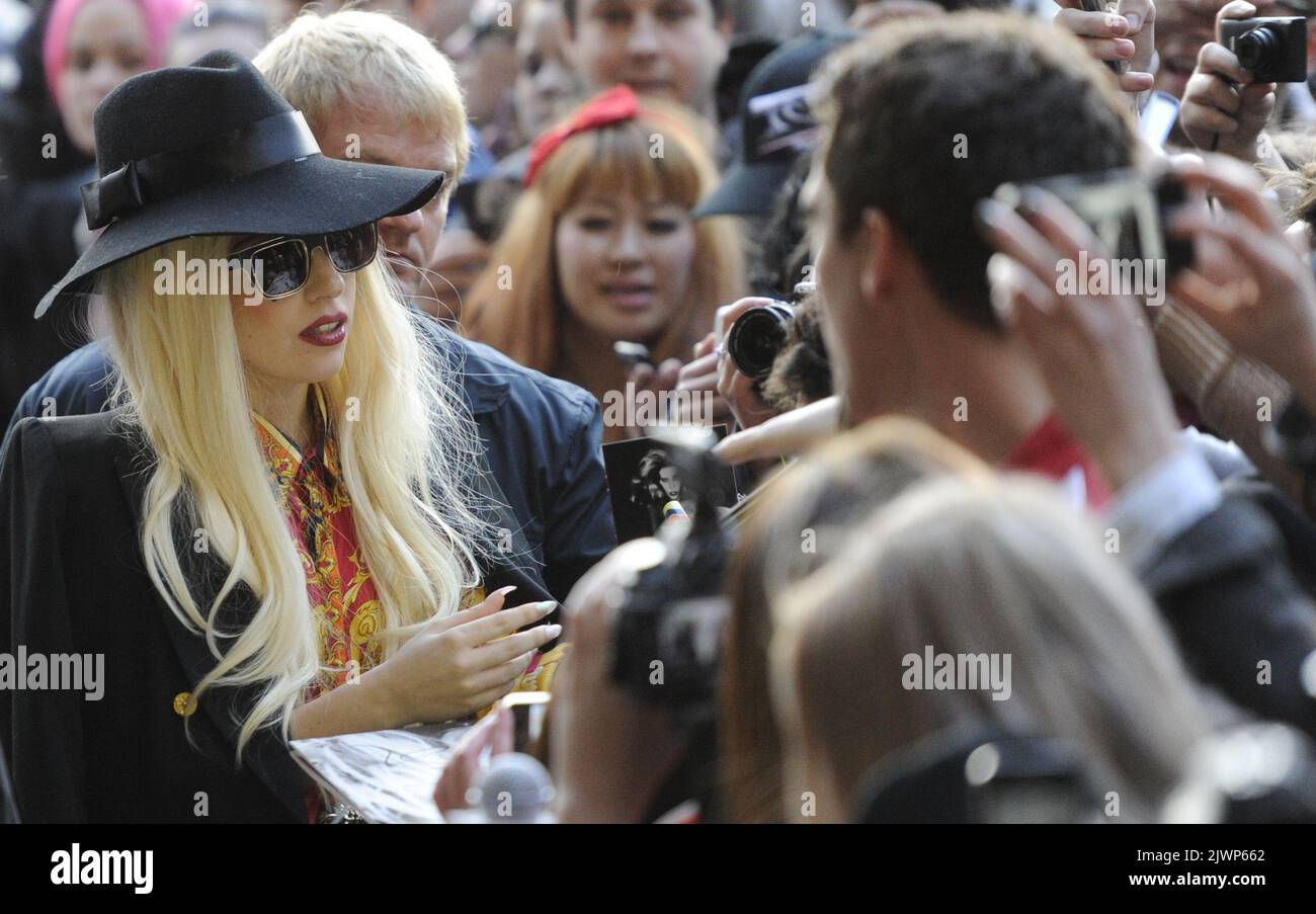 Lady Gaga signs autographs as she arrives at the Park Hyatt in ...