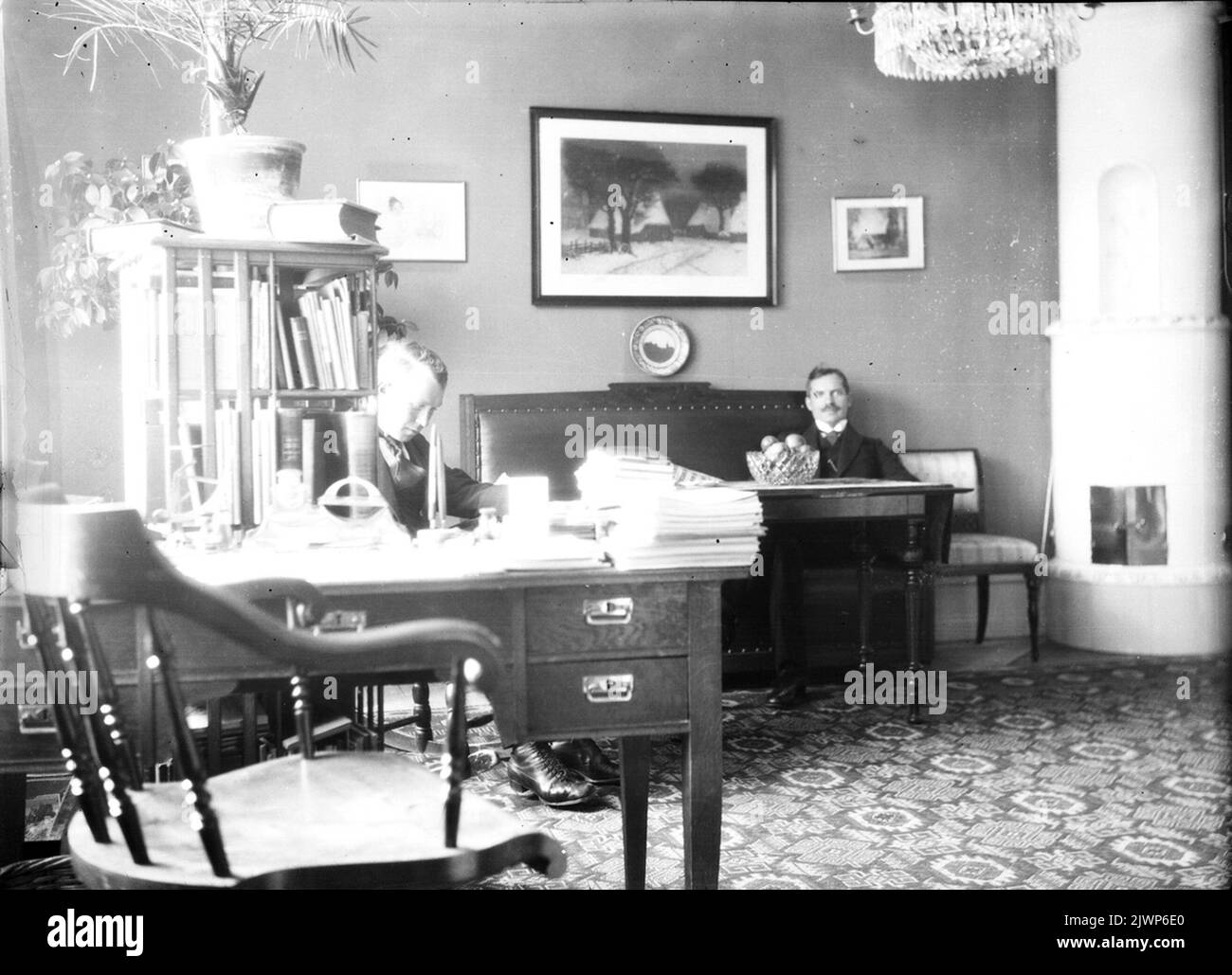 Room interior with two men. Rumsinteriör med två män Stock Photo - Alamy