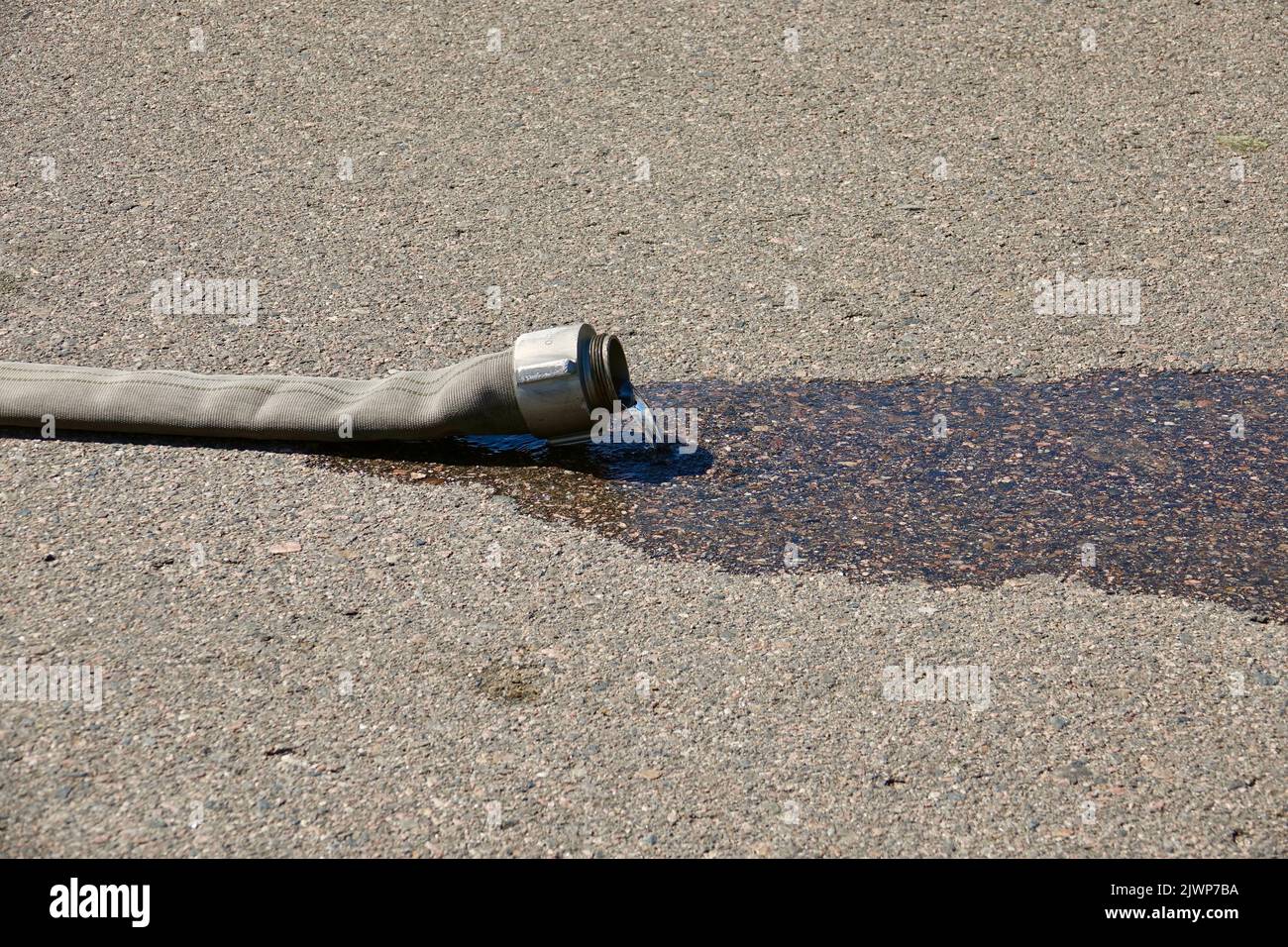 Fireman with hosepipe hi-res stock photography and images - Alamy