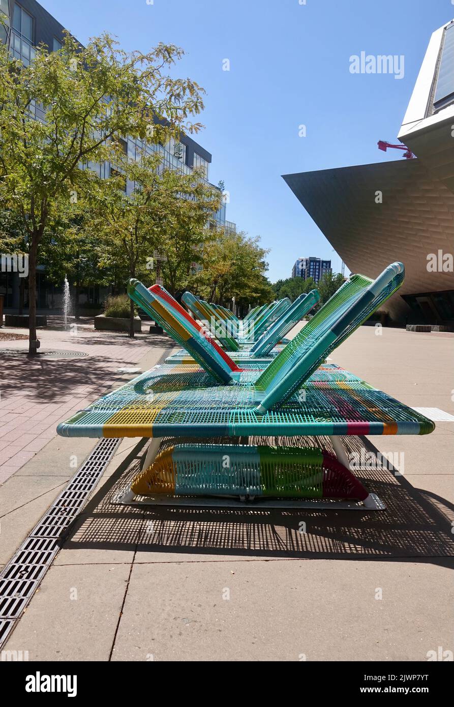 colorful lounge seating outside office buildings downtown Stock Photo ...