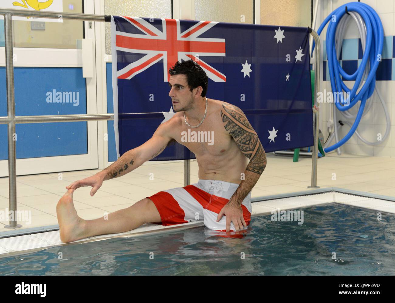 Australian men's hockey player Kieran Govers stretches at a recovery ...