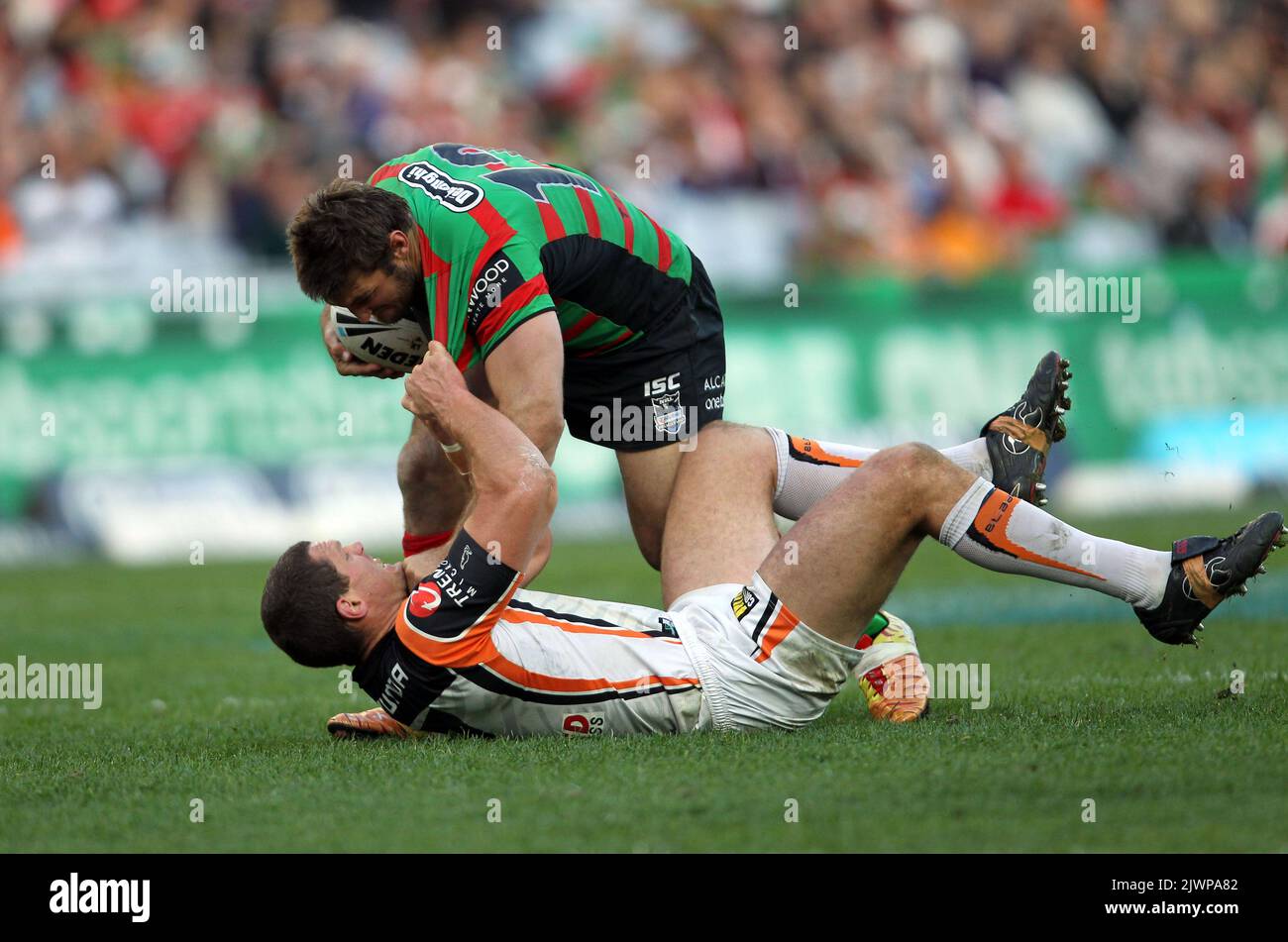 Ray Cashmere has his tackle fended off by Dave Taylor during the NRL ...