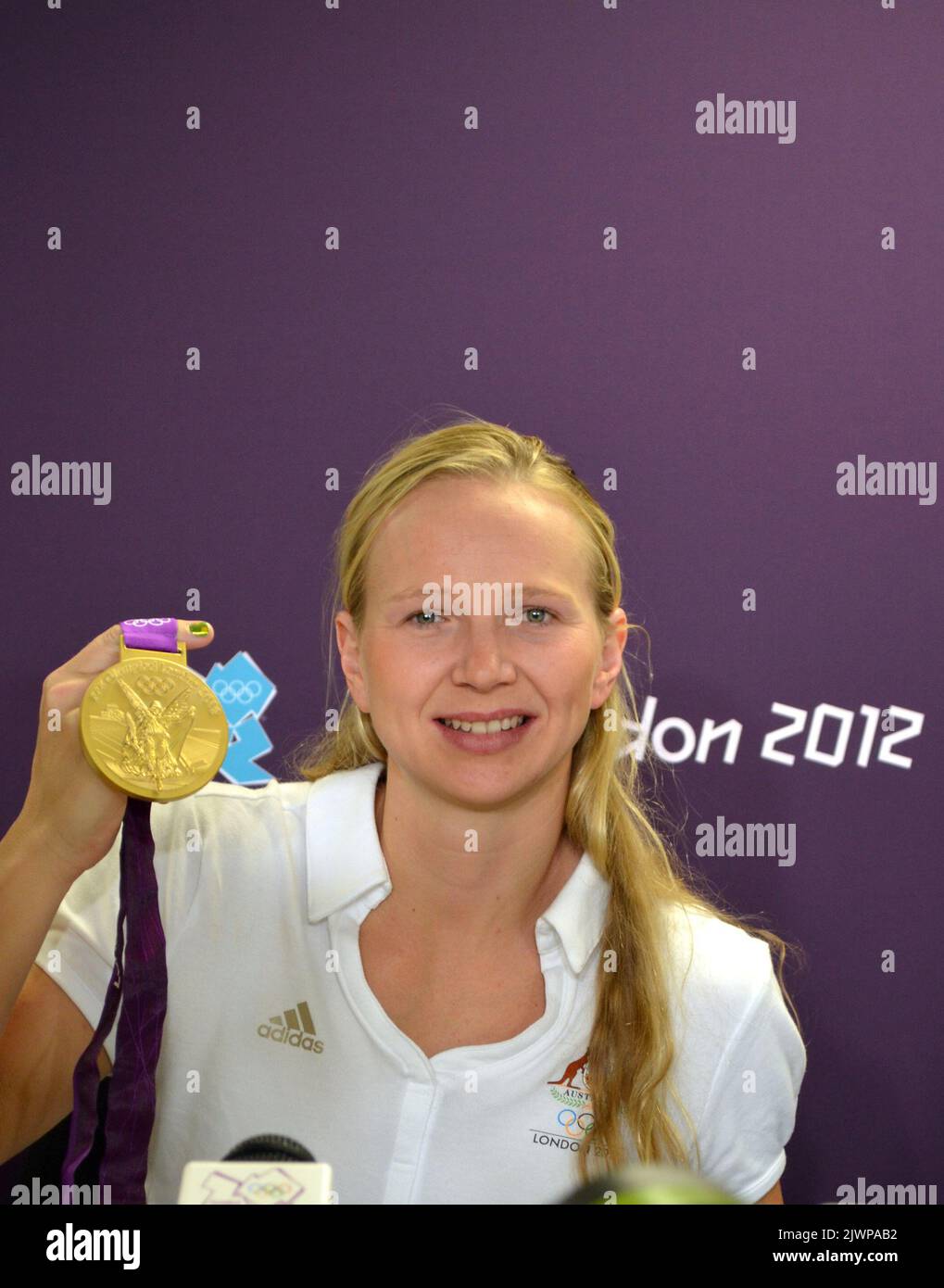 Australian swimmer Melanie Schlanger proudly displays the gold medal ...