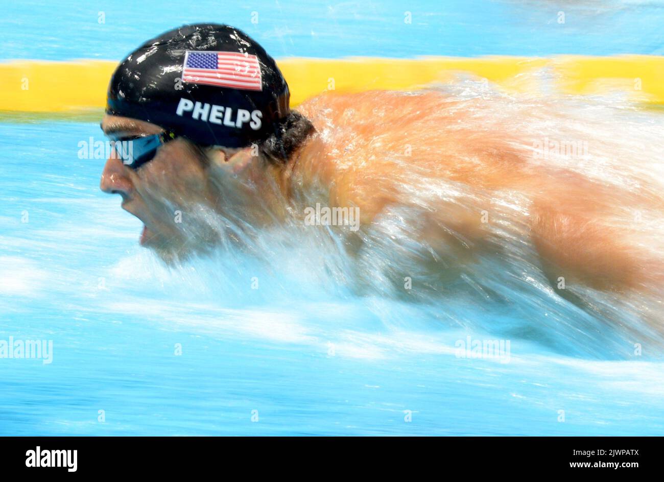 Michael Phelps of the USA leads Chad le Clos of South Africa in the ...