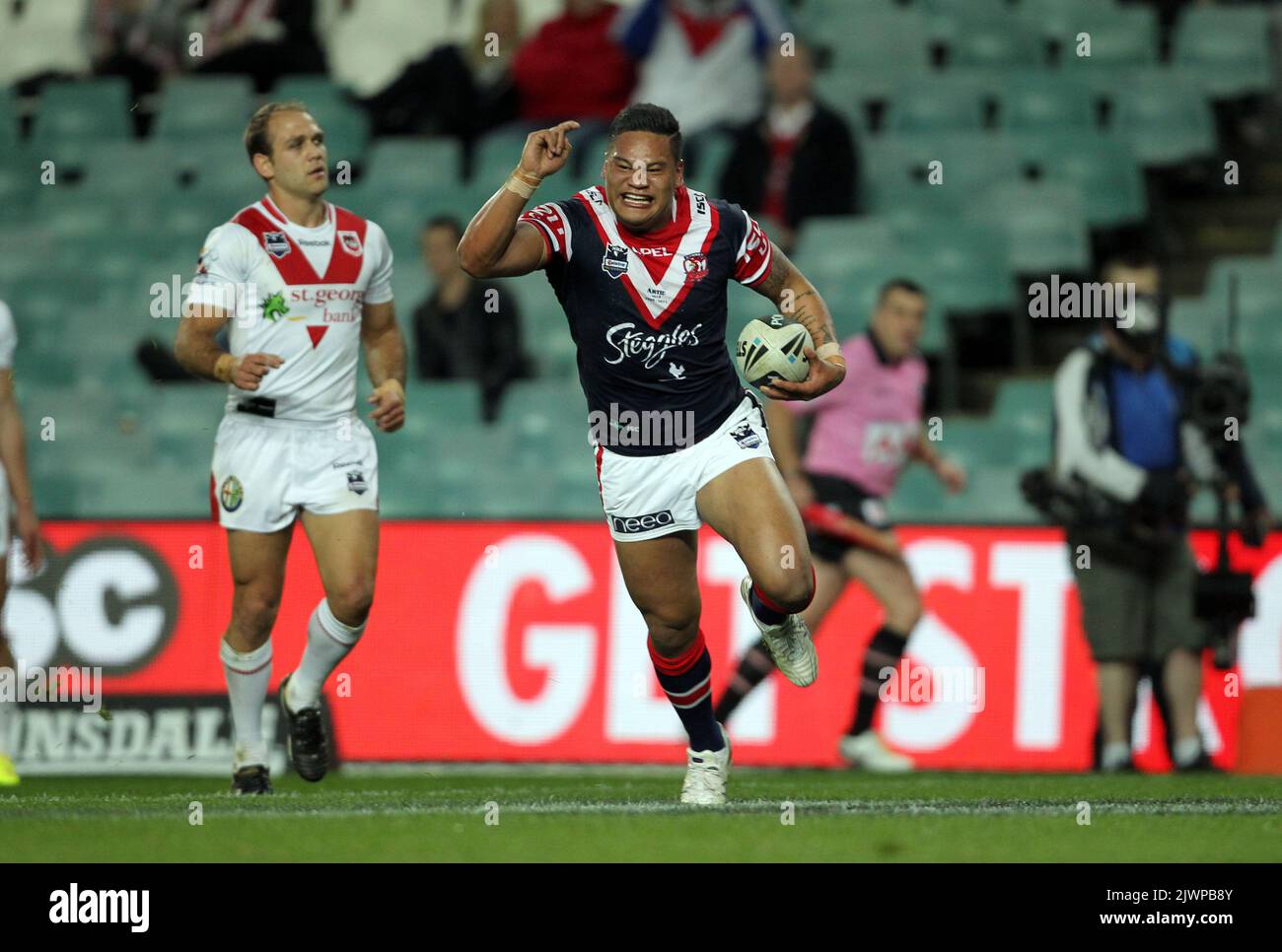 BJ Leilua celebrates as he runs in a try during the NRL round 22 rugby ...