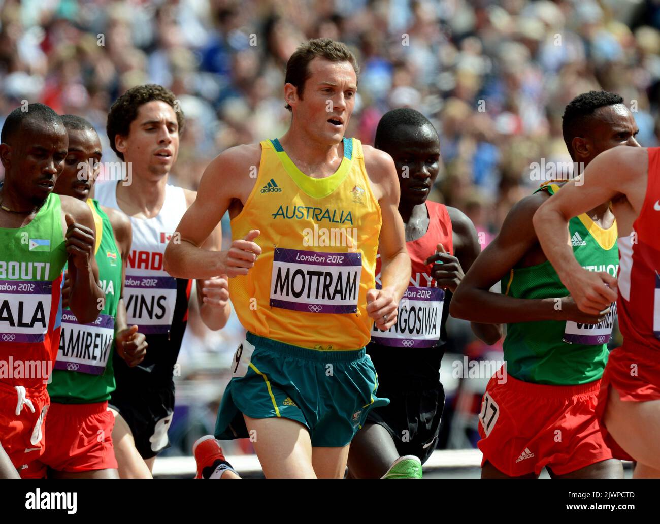 Australian athlete Craig Mottram (centre) runs during the Men's 5000m ...