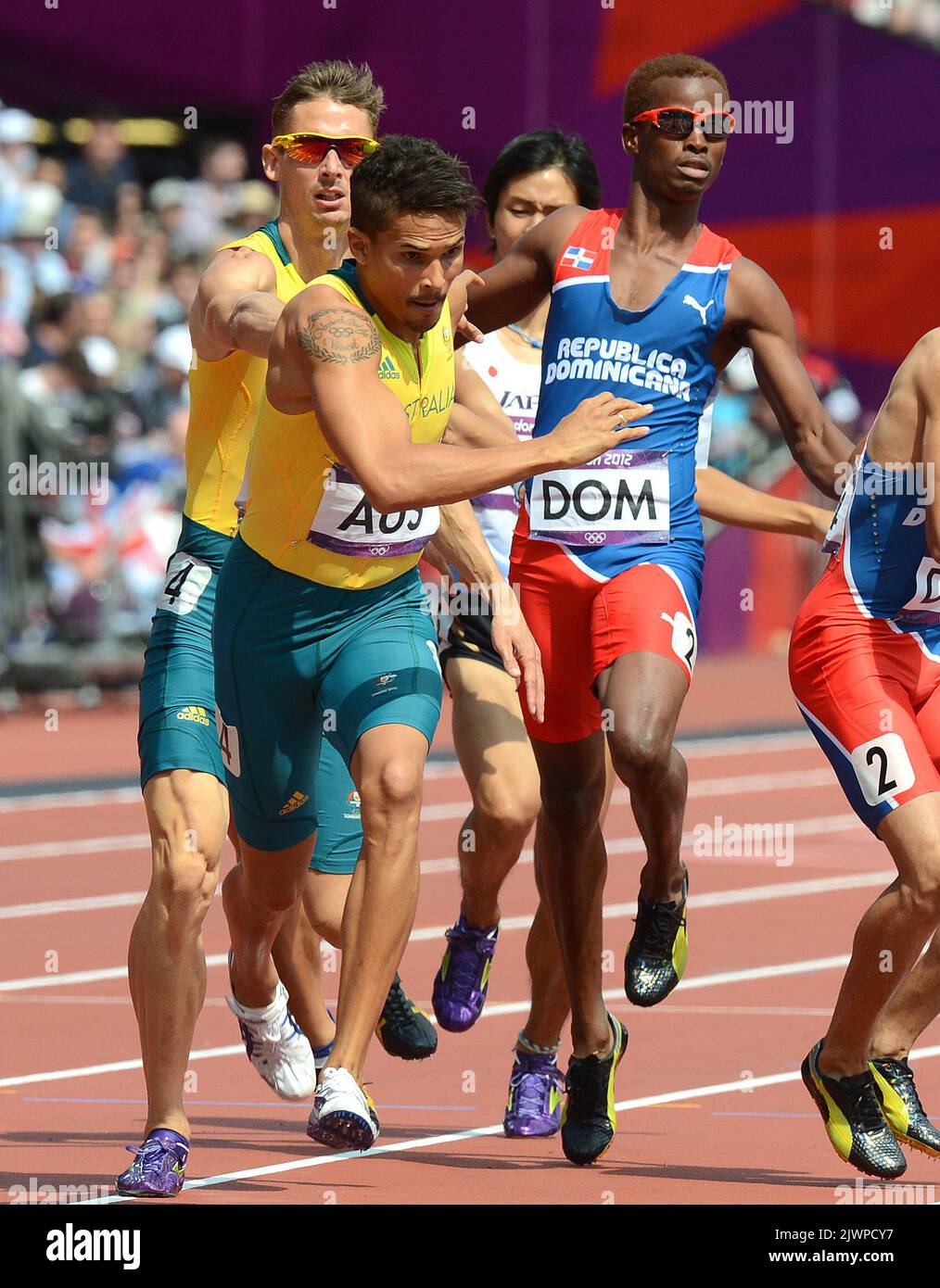 Australia's John Steffensen (centre) runs the 4th leg of the Men's 4 x ...