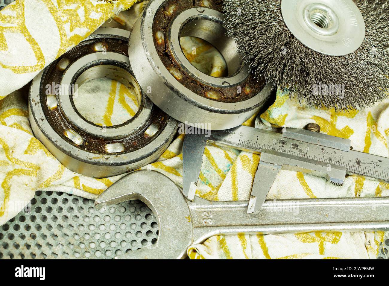 Metalworking tools, steel parts, a wrench, on the background of a metal ...