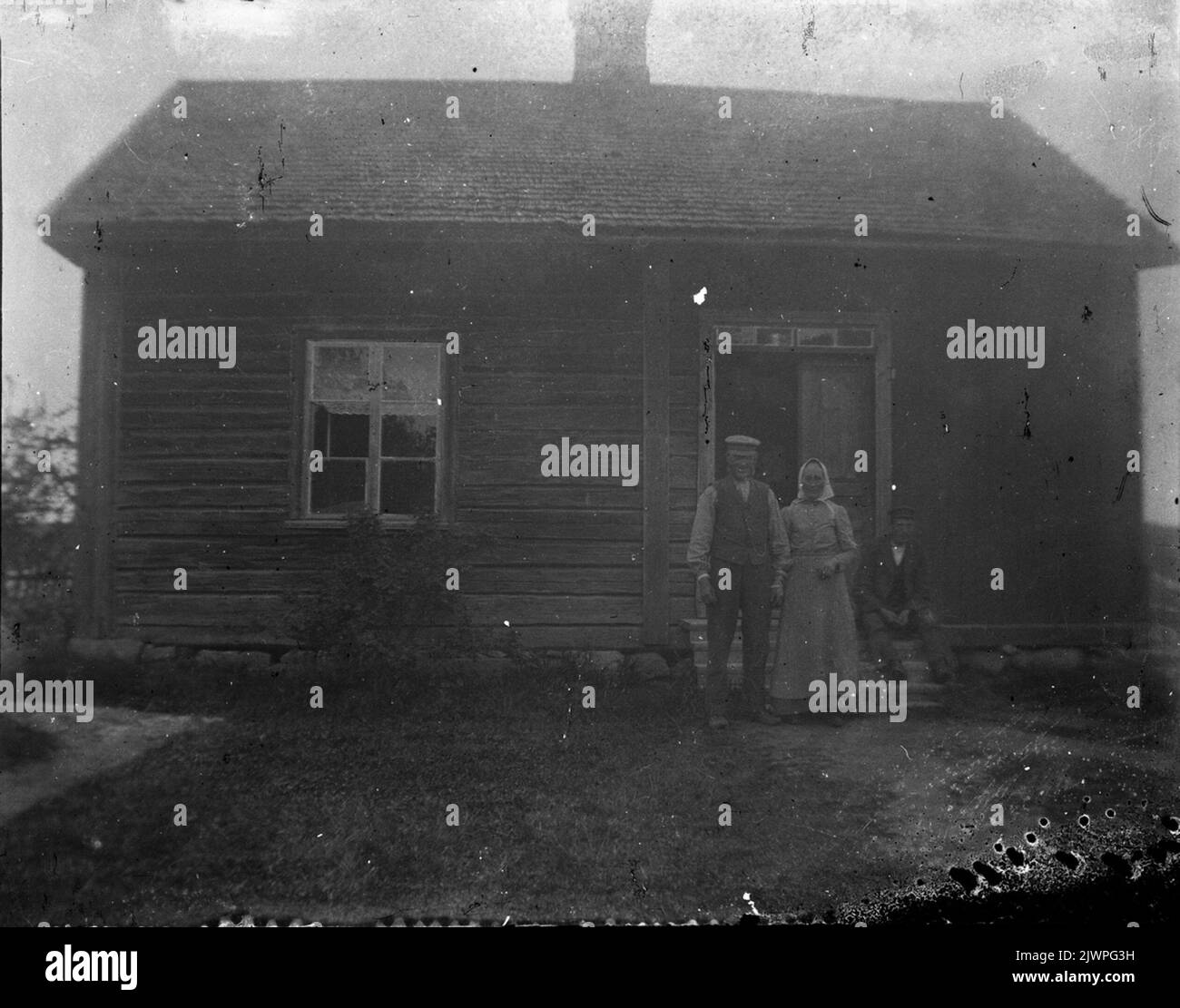 Three people outside housing. Tre personer utanför bostad Stock Photo ...