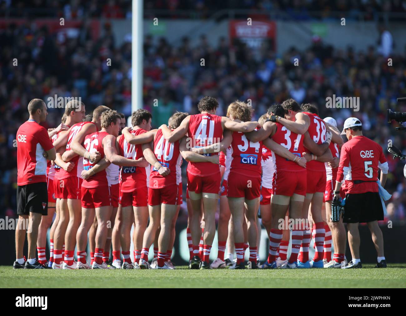 The Sydney Swans huddle together the second qualifying final of the AFL ...