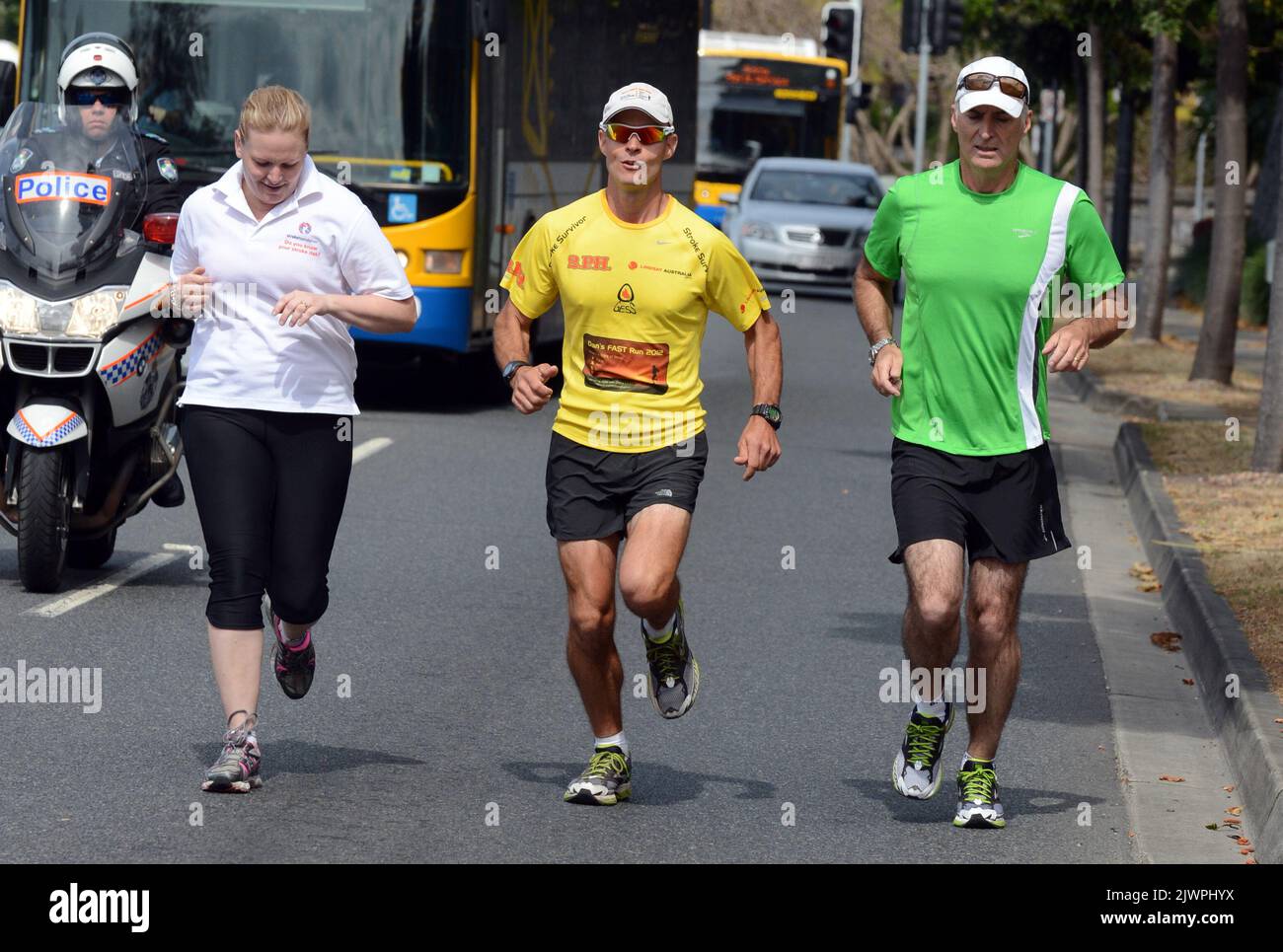 Stroke survivor Dan Englund (centre) runs the last metres of his 1000km ...