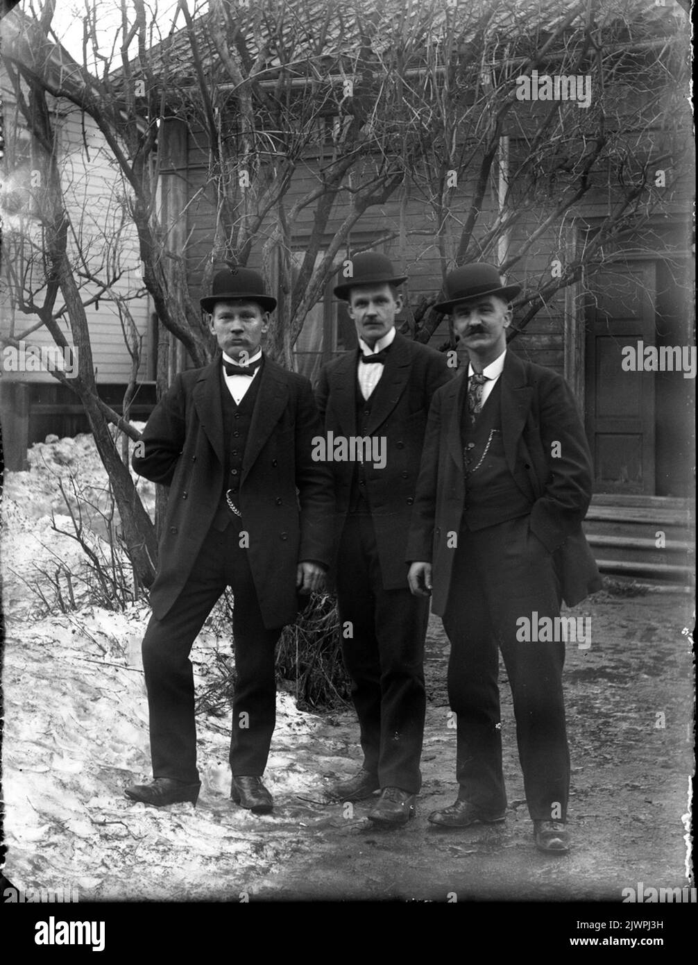 Portrait man standing three Black and White Stock Photos & Images - Alamy