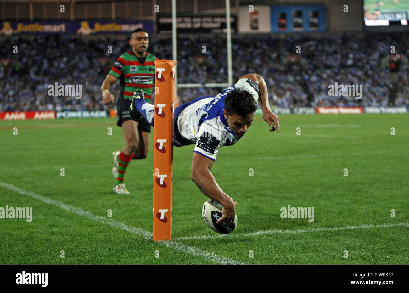 Sam Perrett scores a try for the dogs during the NRL Round 13 match ...