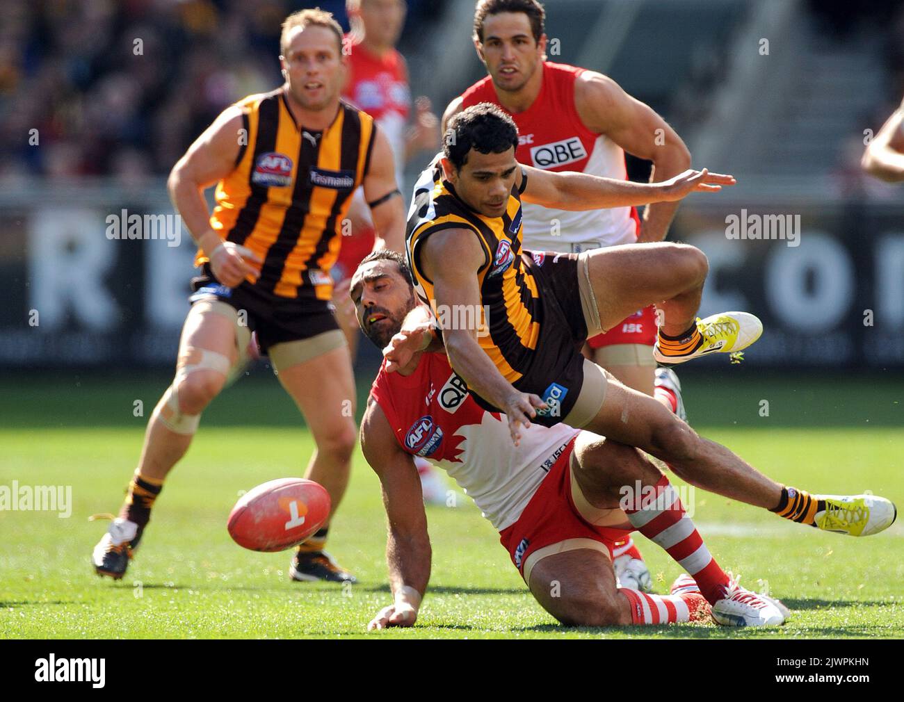 Cyril Rioli of Hawthorn and Adam Goods of Sydney contest for the ball ...