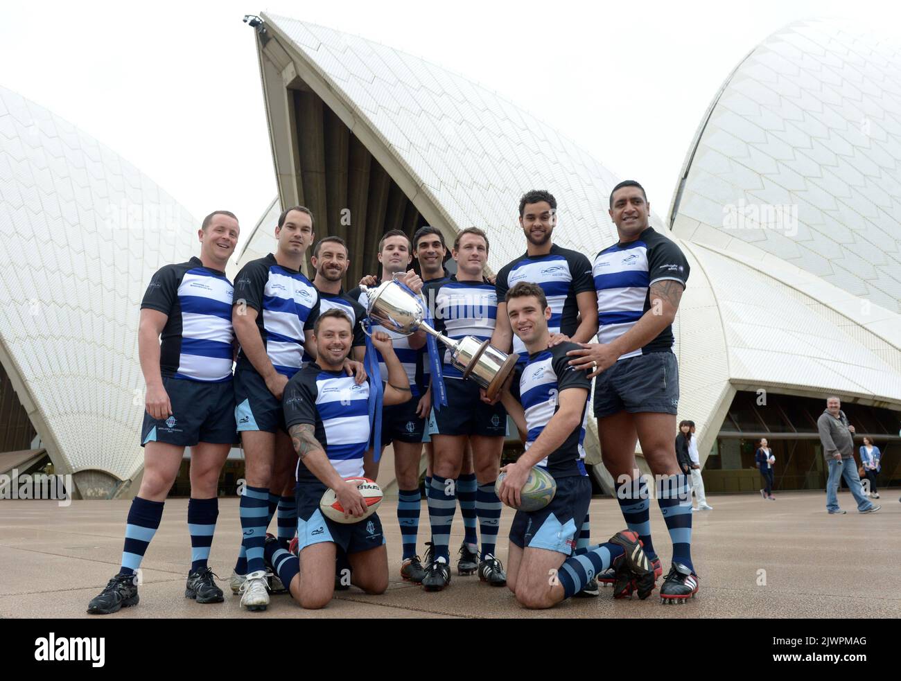 The Sydney Convicts gay rugby club pose with the Bingham Cup in front ...