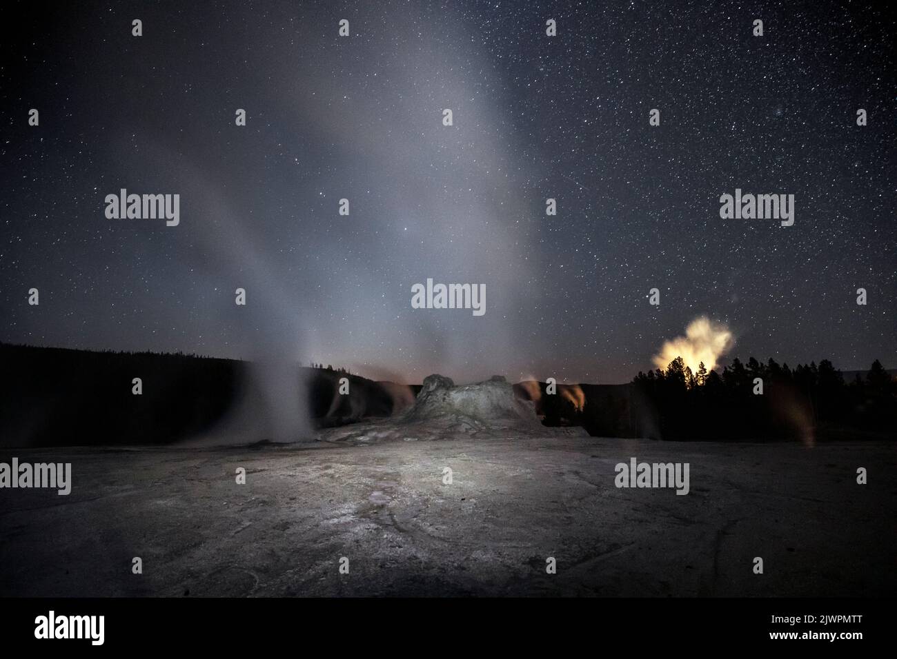WY05029-00....WYOMING - Night view with Castle Geyser with Old Faithful ...