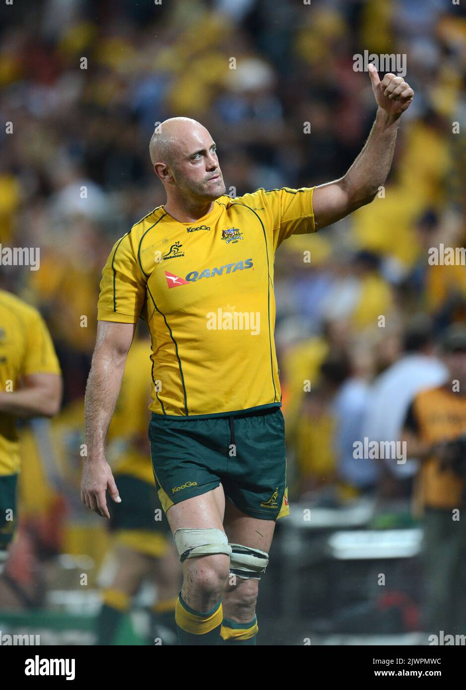 Australia's captain Nathan Sharpe acknowledges the crowd after playing ...