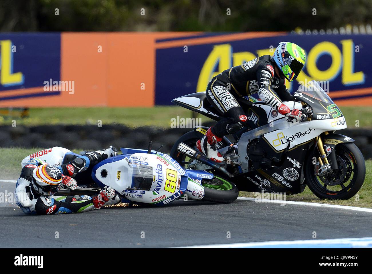Spanish Rider Julian Simon crashes into Brazilian Rider Eric Granado ...